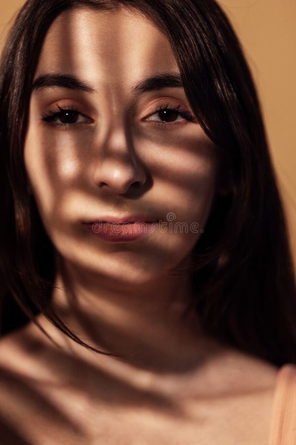 Portrait of Thoughtful Beautiful Girl Sitting on White Cube Stock Photo ... Portrait of Thoughtful Beautiful Girl Sitting on White Cube Stock Photo ...