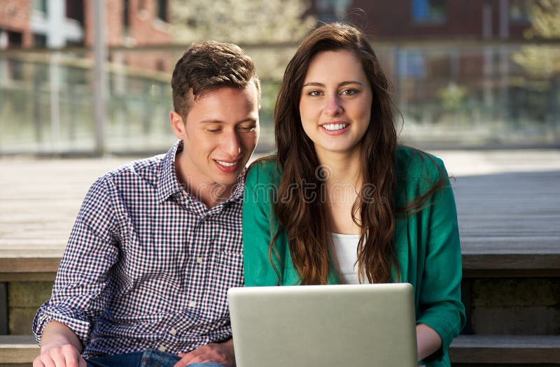 Close Up Portrait of Two College Students Working on Laptop Outdoors ...