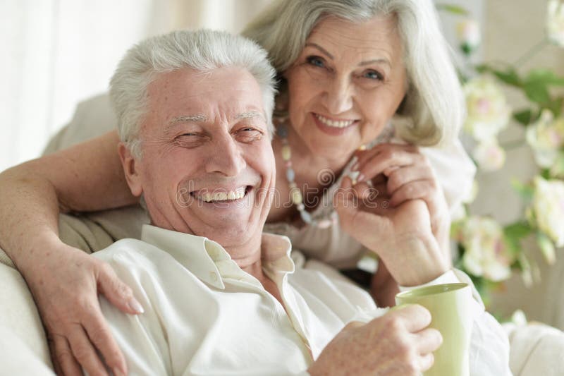 Close Up Portrait of Two Elderly People Resting at Home with Tea Stock ...