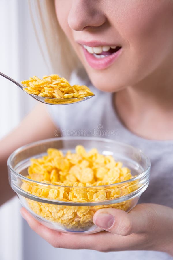 Close Up Portrait of Woman Eating Corn Flakes Stock Image - Image of ...