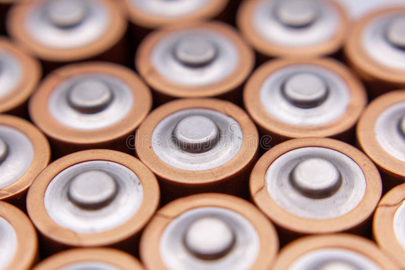 Close-up of AA Batteries on a Smooth Surface. Focus on Battery Detail ...