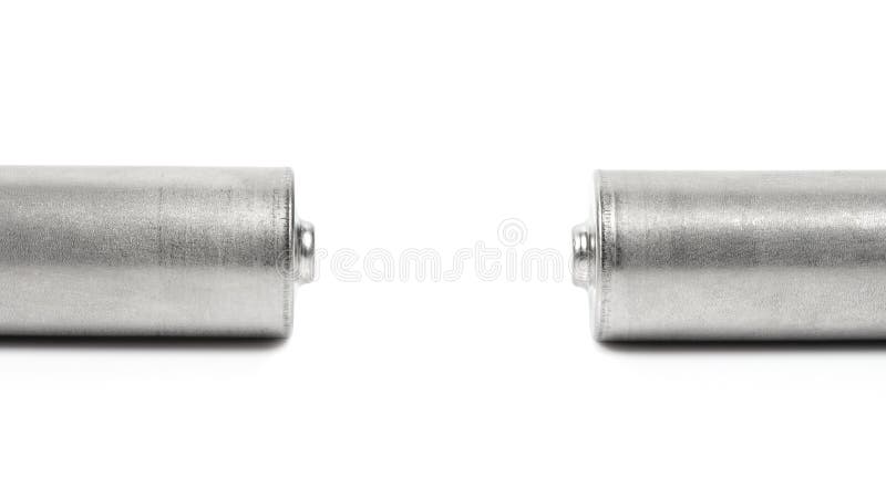 Close Up of the Positive Poles of Two Batteries Stock Photo - Image of ...