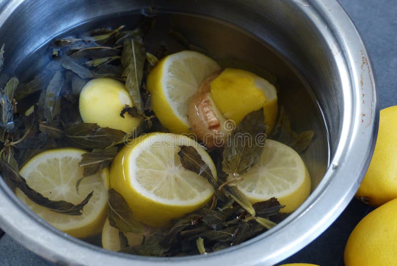 Pot Full of Boiled Lemons, Mint, and Ginger for Flu Stock Photo - Image ...