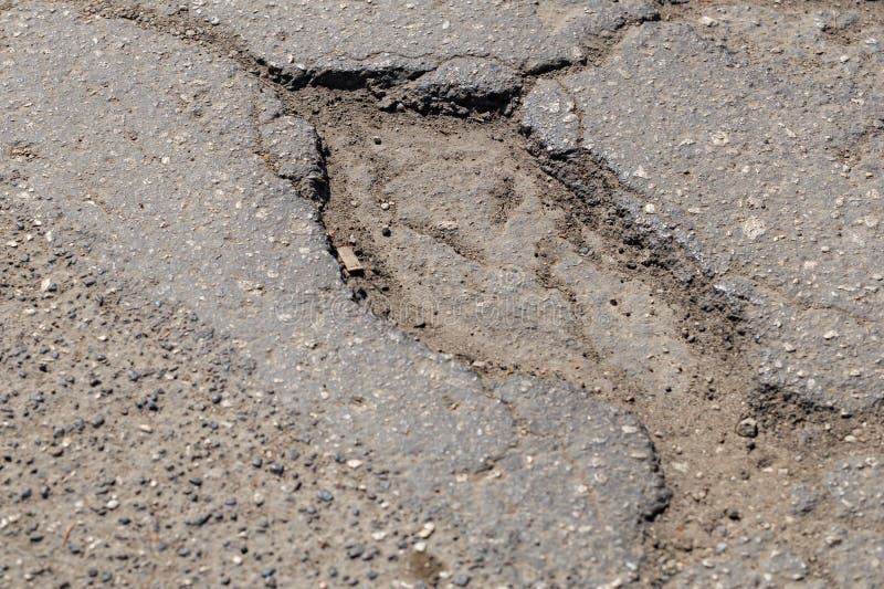 Close-up of a Pothole on Worn Asphalt Road Surface Stock Image - Image ...