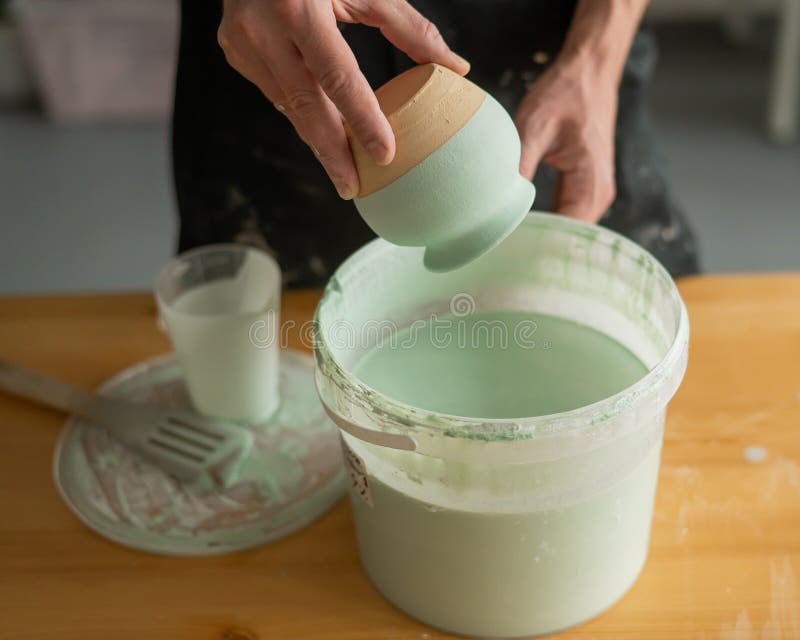 Close-up of a Potter S Hands Glazing a Pottery Piece. Stock Image ...