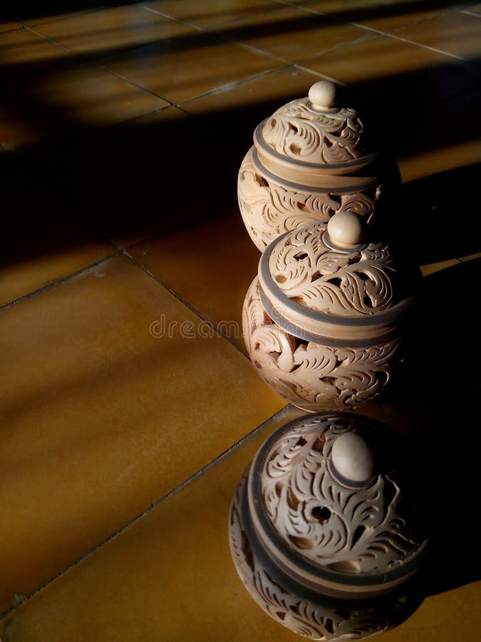 Close Up Pottery Brown Color with Light Coming from the Side on Floor ...