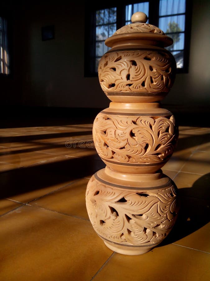 Close Up Pottery Brown Color with Light Coming from the Side on Floor ...