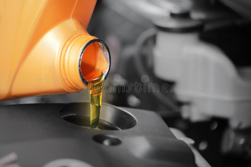 Pouring Motor Oil stock photo. Image of engine, hand - 15257372