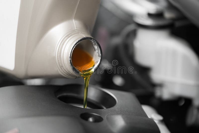Pouring Motor Oil stock photo. Image of engine, hand - 15257372