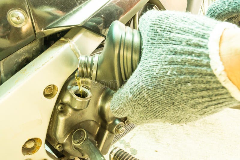 Close Up of Pouring New Oil To Motorcycle Engine Stock Photo - Image of ...