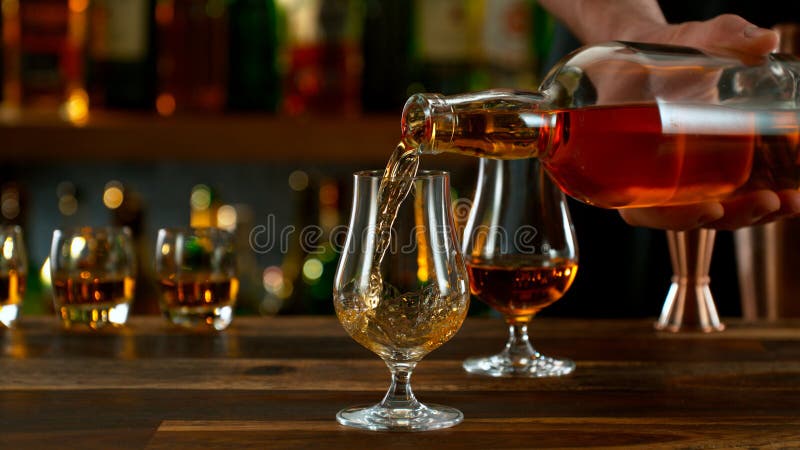 Close-up of Pouring Whiskey or Rum Stock Photo - Image of super, freeze ...