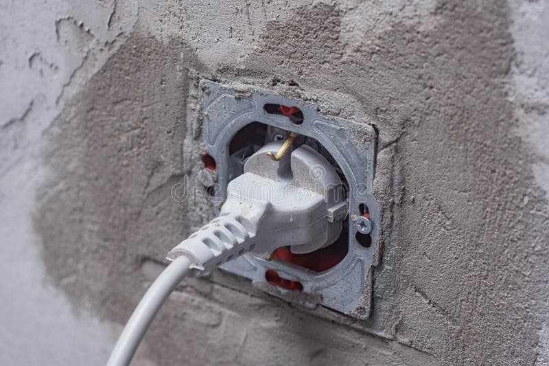 Close-Up of a Power Plug Connected To an Electrical Socket during ...