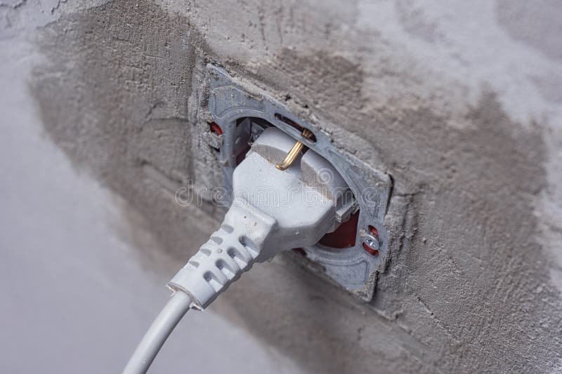 Close-Up of a Power Plug Connected To an Electrical Socket during ...