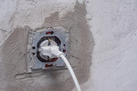 Close-Up of a Power Plug Connected To an Electrical Socket during ...