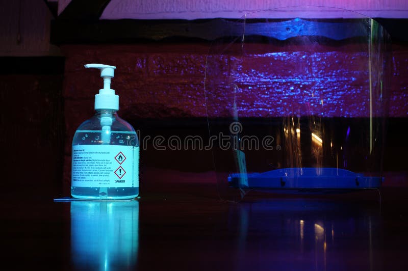 Hand Sanitizer Bottle & Face Visor for COVID 19 Protection Stock Photo ...
