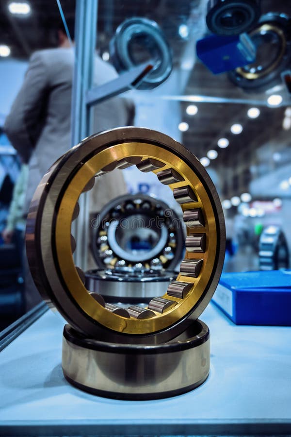 Close-up of a Precision Roller Bearing with Brass Cage on Display. Industrial Engineering and ...