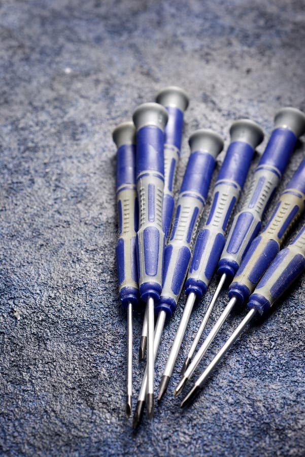 Metal Precision Screwdriver Group on a Blue Table Stock Image - Image ...