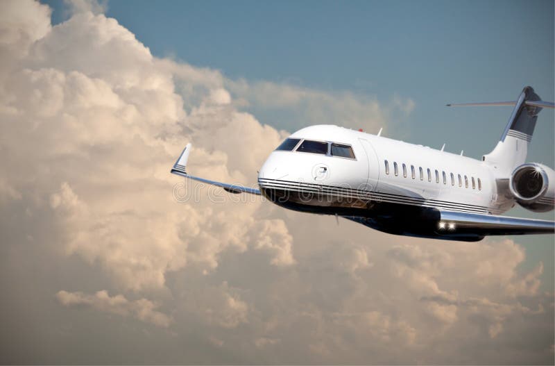 Close Up of a Private Jet Flying through Cloudy Skies Stock Image ...