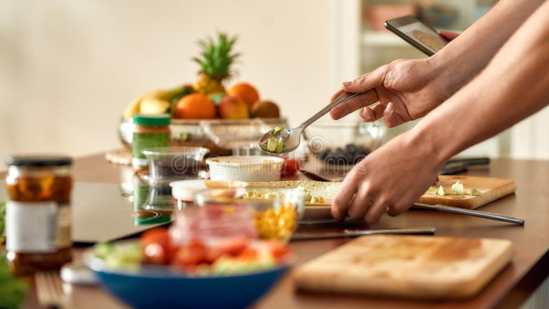 Close Up of Process of Cooking. Man Preparing Meal while Woman Checking ...