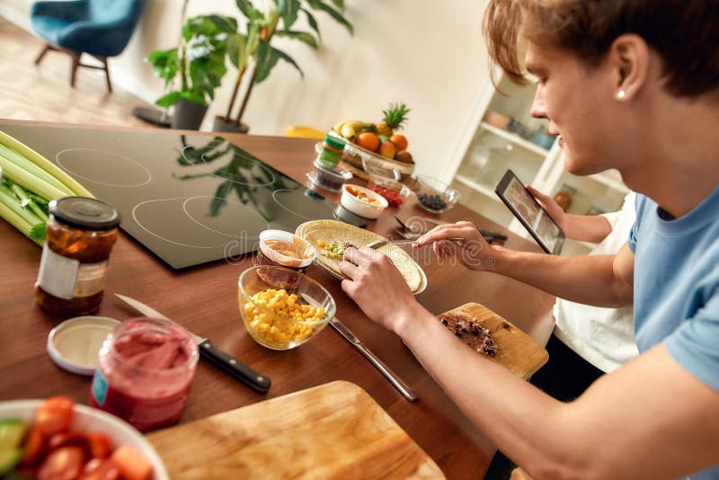 Close Up of Process of Cooking. Man Preparing Meal while Woman Checking ...