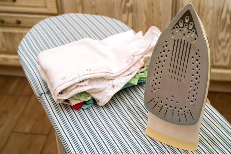 Pressboard and iron stock photo. Image of ironing, domestic - 111498700