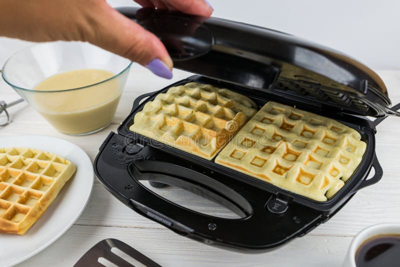 Close-up of the Process of Making Belgian Waffles in a Waffle Iron at ...