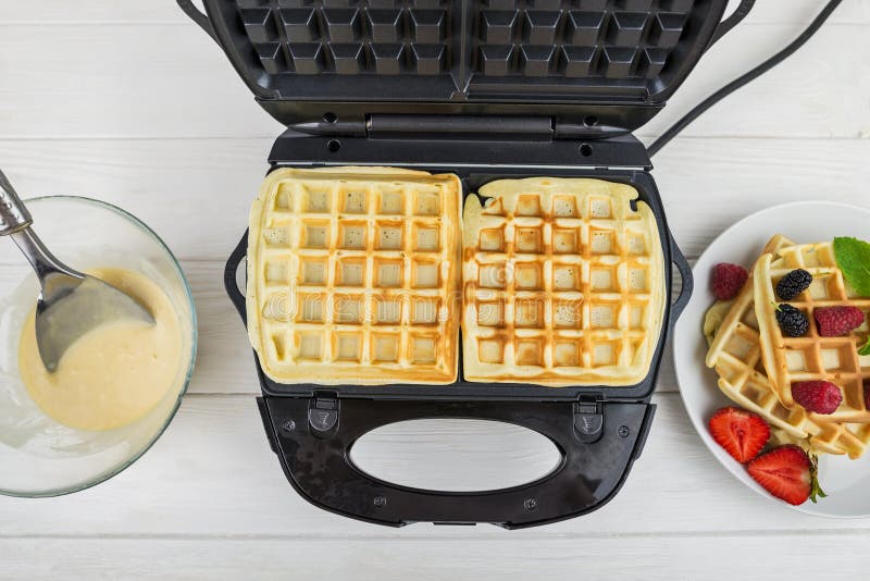Close-up of the Process of Making Belgian Waffles in a Waffle Iron at ...