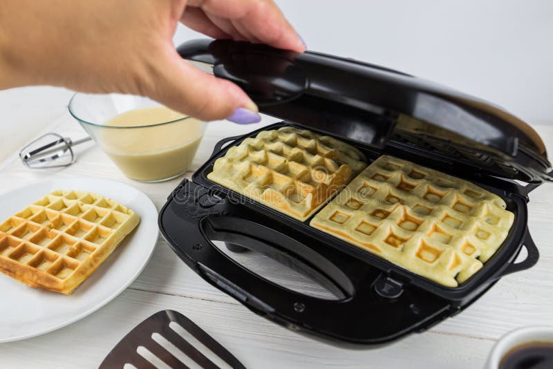 Close-up of the Process of Making Belgian Waffles in a Waffle Iron at ...