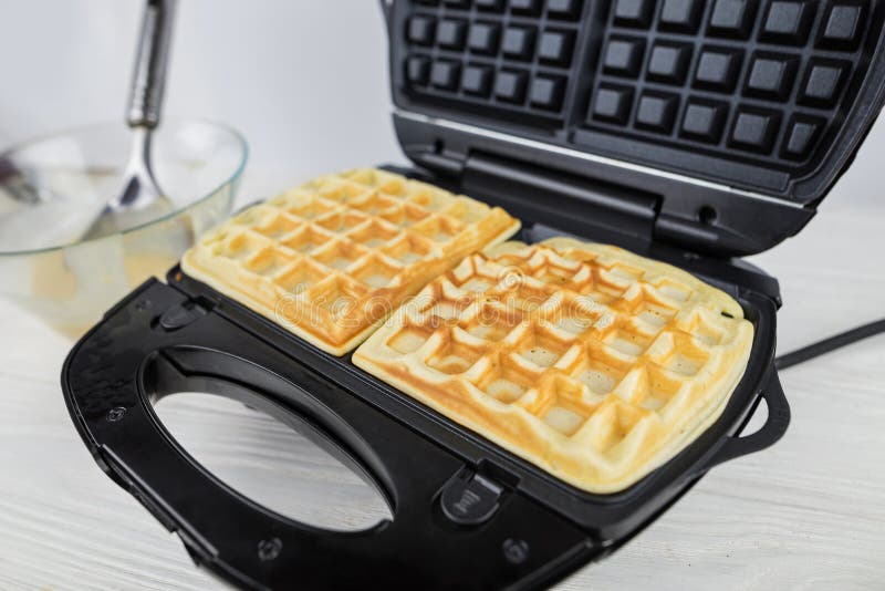 Close-up of the Process of Making Belgian Waffles in a Waffle Iron at ...