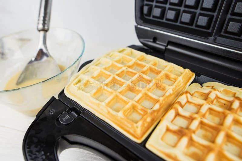 Close-up of the Process of Making Belgian Waffles in a Waffle Iron at ...