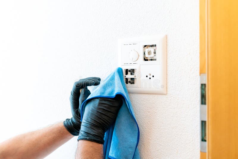 Close Up of a Professional Cleaner Cleaning a Modern Light Switch and ...