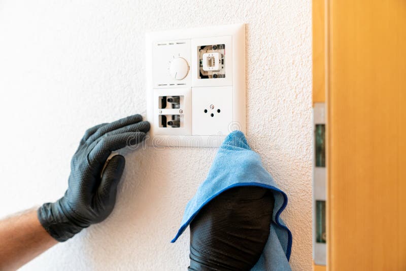 Close Up of a Professional Cleaner Cleaning a Modern Light Switch and ...