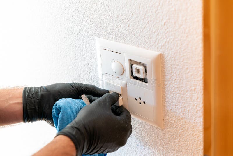 Close Up of a Professional Cleaner Cleaning a Modern Light Switch and ...