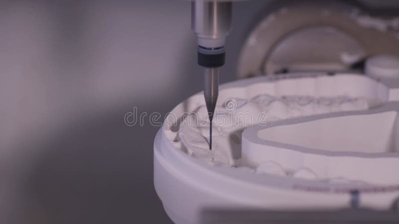 CNC Dental Milling Machine Carving Out Shape of Artificial Teeth in the ...