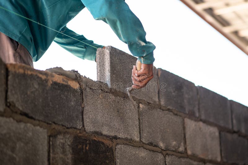 Close-up of Professional Construction Worker Laying Bricks. Stock Photo ...