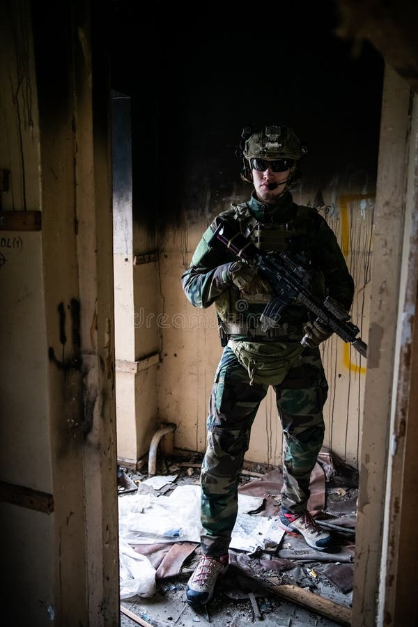 Close-up of a Professional Fully Equipped Soldier Looking at Camera ...