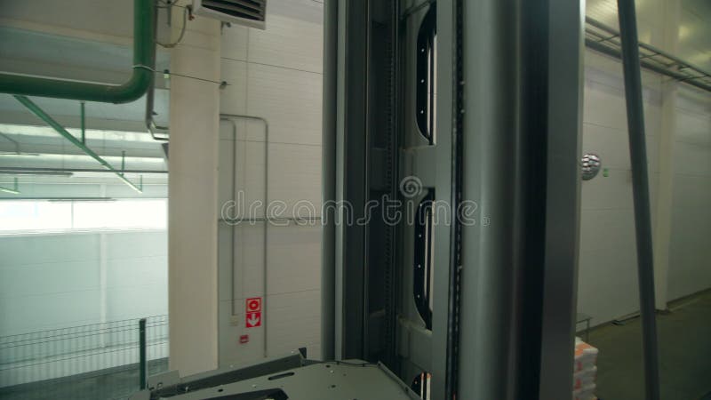 Close Up of a Professional Loader in Motion Inside Industrial Warehouse ...
