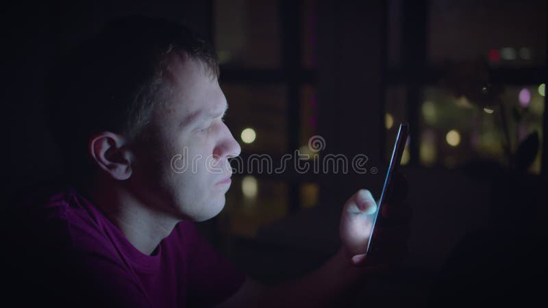 Close-up Profile of a Man Using a Smartphone Scrolling through Social ...