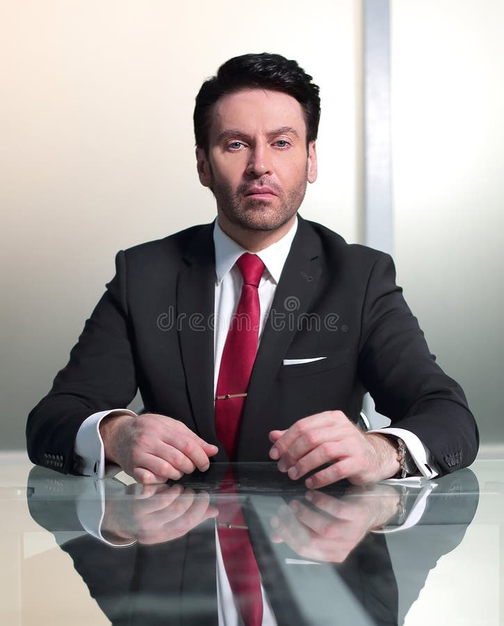 Manager Sitting at His Desk and Looking at the Camera Stock Photo ...