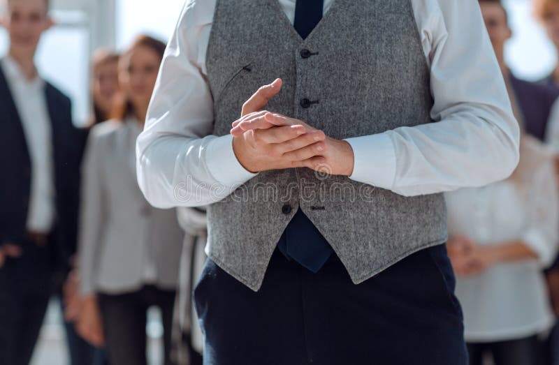 Close Up. Project Manager Standing in Front of the Business Team.close ... Close Up. Project Manager Standing in Front of the Business Team.close ...