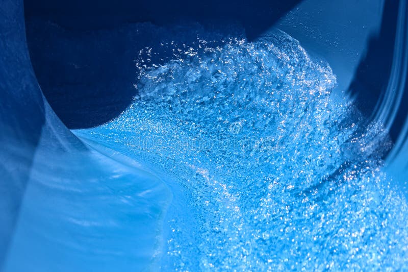 Close-up of Propelling Water Moving Rapidly Down Recreational Slide ...