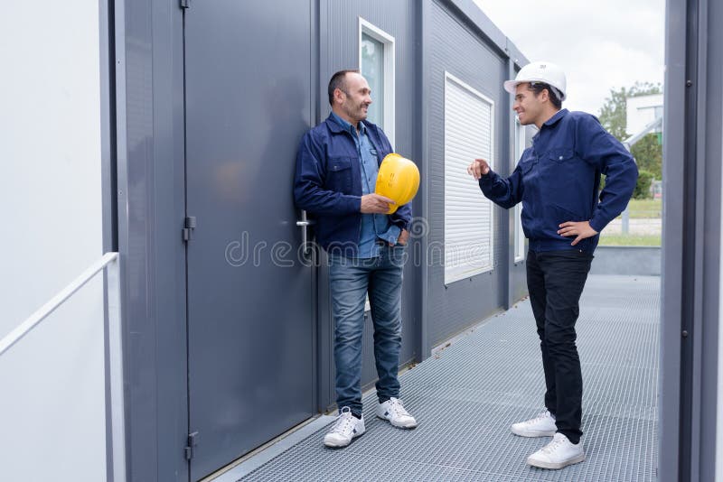 Close Up Public Engineers Talking Stock Image - Image of home, chatting ...