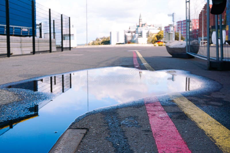 Close Up of a Puddle on Asphalt Stock Photo - Image of road, asphalt ...