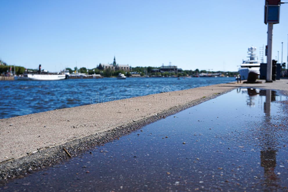 Close Up of a Puddle on a Pier Stock Image - Image of landscape ...