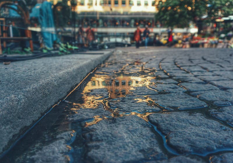 Close-up of Puddle on Street Stock Image - Image of city, lane: 254189691