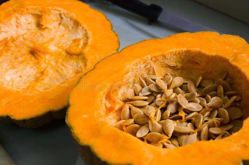 Close-up of a Pumpkin Split in Half that Has Seeds Stock Image - Image ...