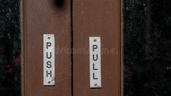 Close Up from Push and Pull Text on Doors Stock Image - Image of plates ...