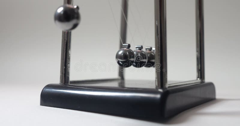 Kinetic Pendulum with Metal Spheres Swinging and Slowing Down, Over ...