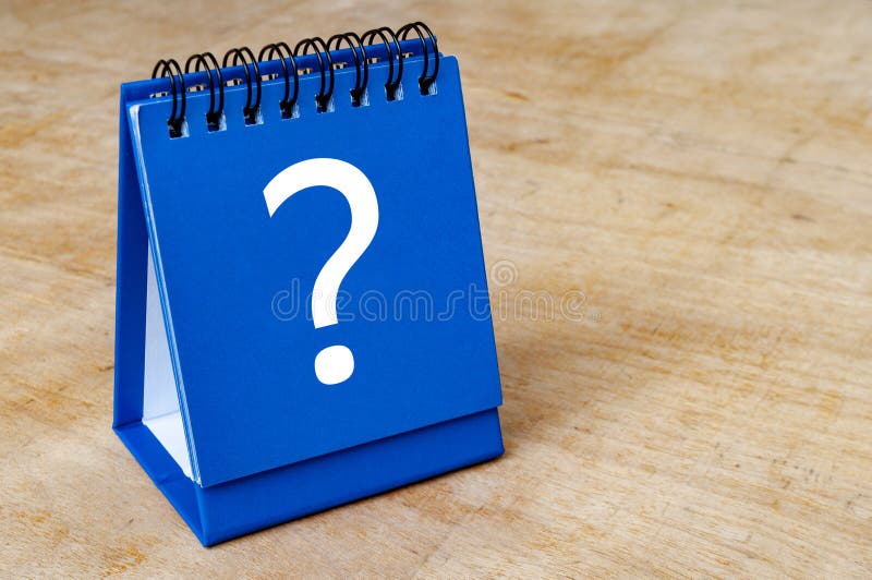 Close Up of Question Mark on Blue Notepad on Wooden Background ...