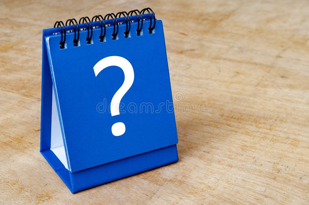 Close Up of Question Mark on Blue Notepad on Wooden Background ...